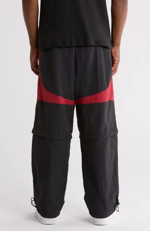 Umbro Zip-Off Loose Fit Pants In Black / Red Dahlia / Iron Gate